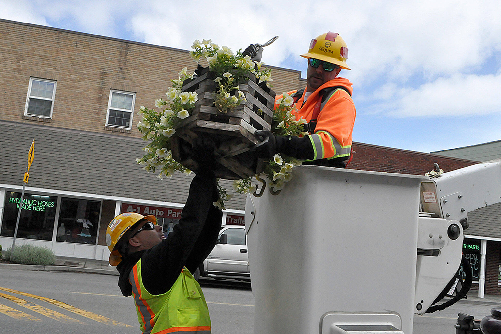 Flower baskets line city streets for summer | Sequim Gazette